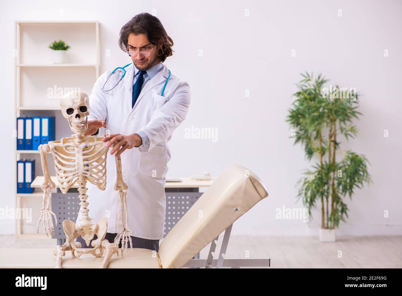 Crazy doctor examining the dead patient Stock Photo - Alamy
