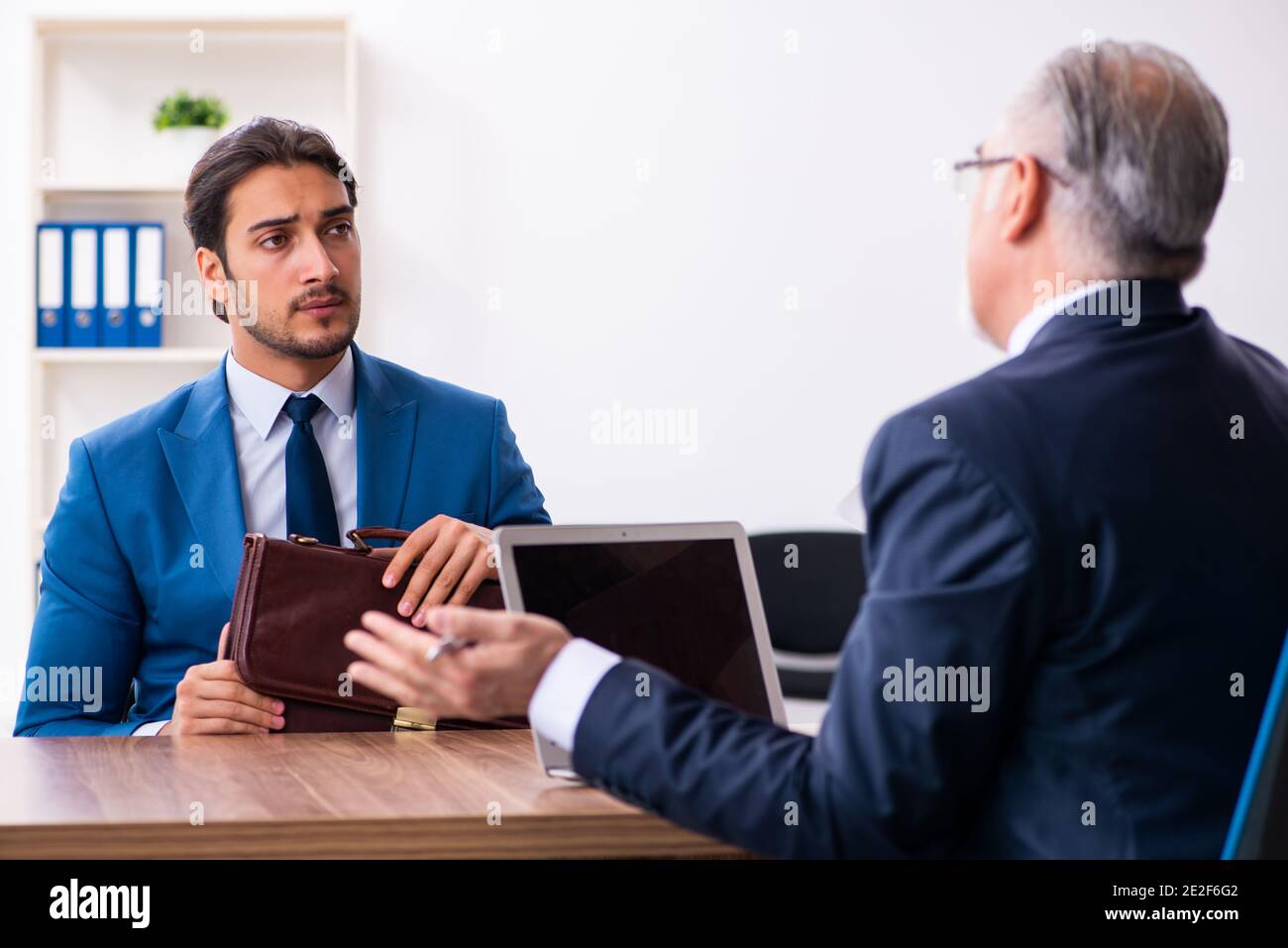 Male candidate employee meeting with old recruiter Stock Photo - Alamy