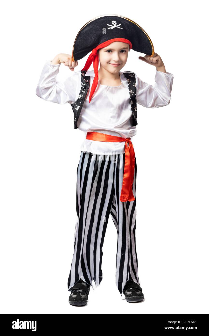 Portrait of smiling boy in pirate costume and hat posing showing biceps ...