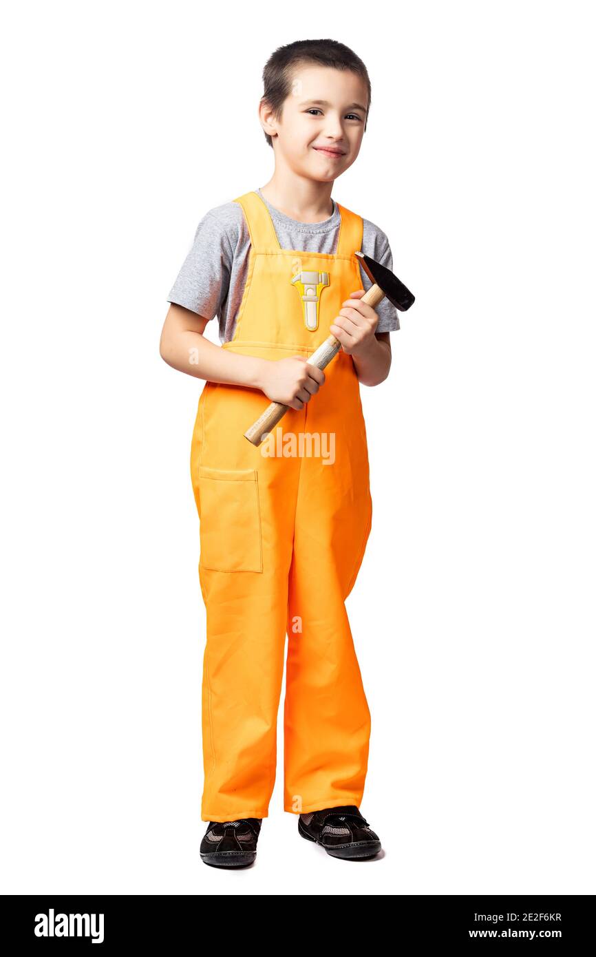 Portrait of a smiling boy carpenter in orange work overalls posing ...