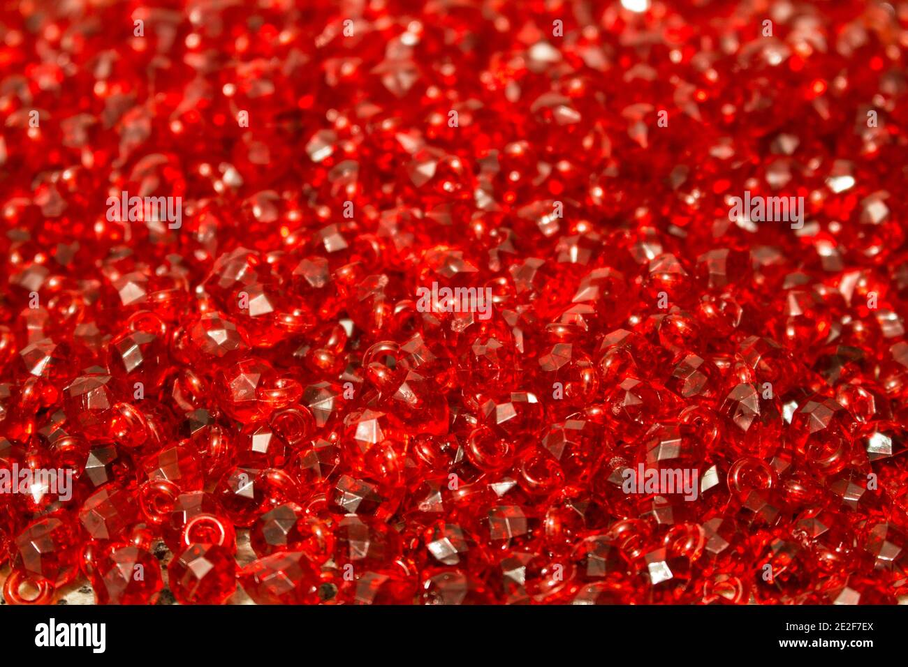Group of bright red glass beads together for jewelllery Stock Photo - Alamy