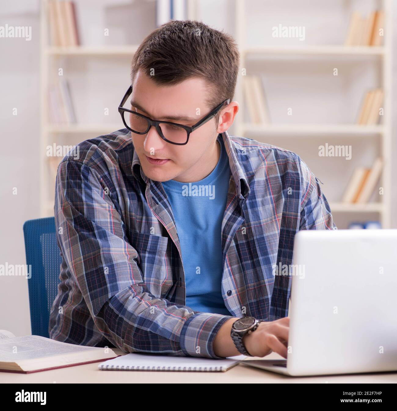 The young student studying over internet in telelearning concept Stock ...