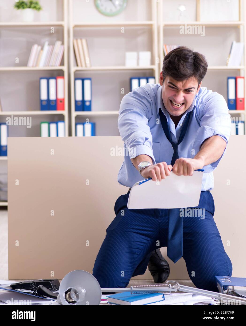 The angry businessman frustrated with too much work Stock Photo - Alamy