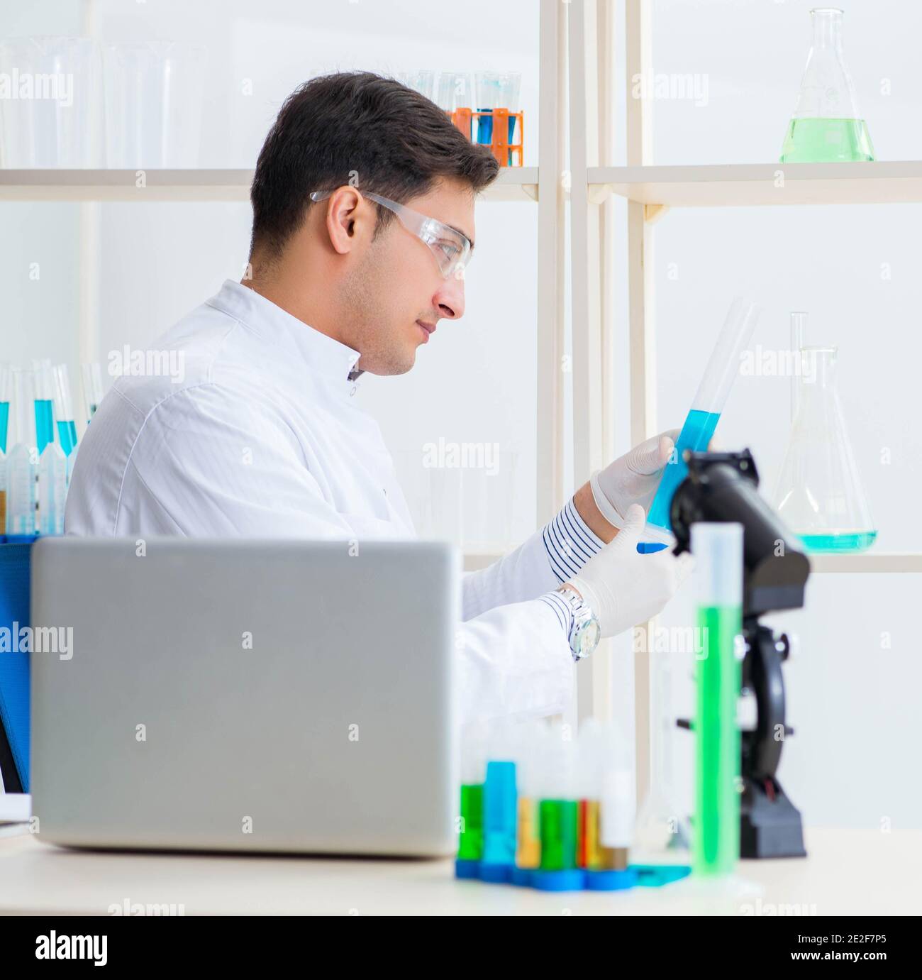 The male chemist working in lab Stock Photo - Alamy