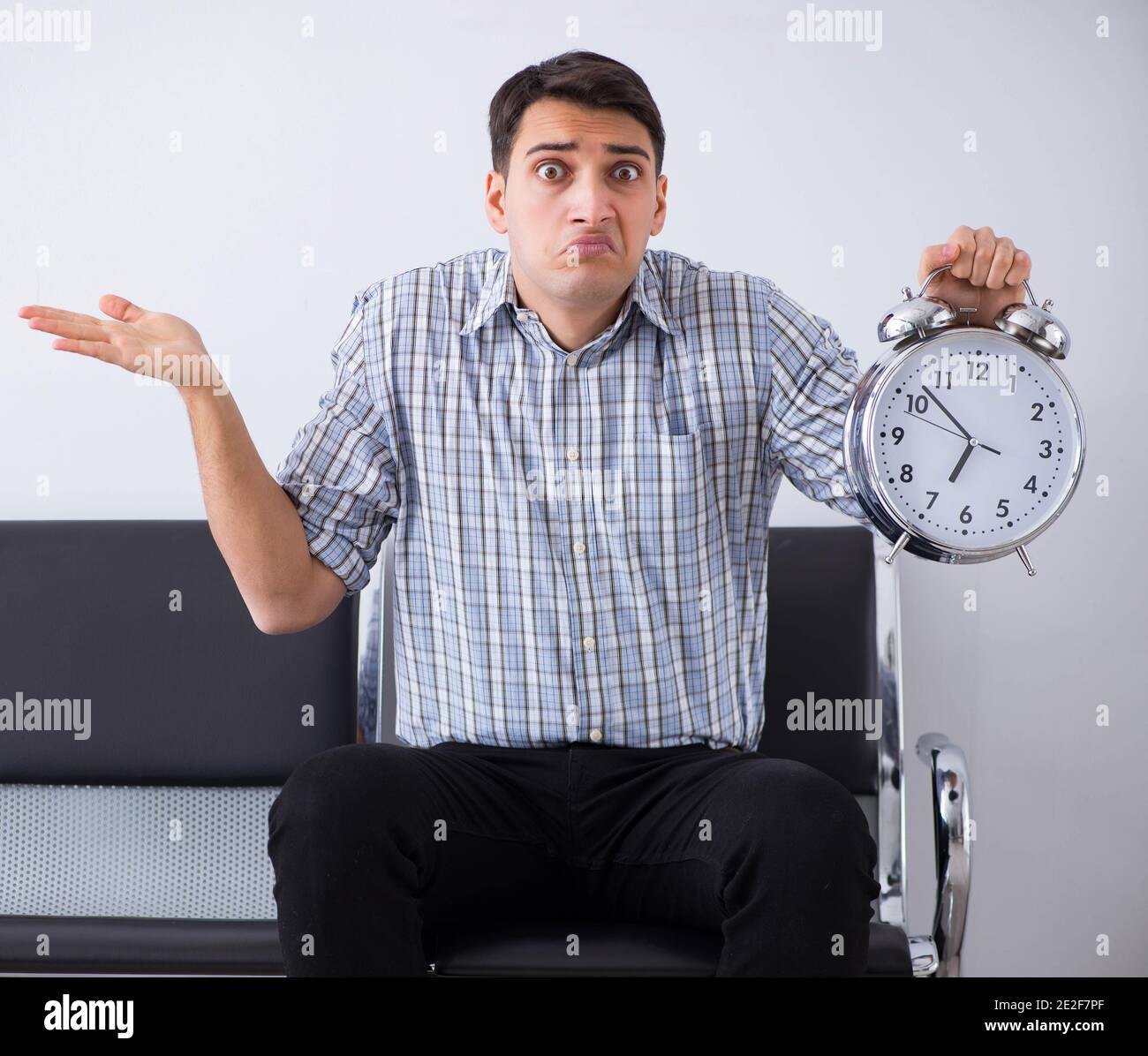 The man nervously impatiently waiting in the lobby Stock Photo - Alamy