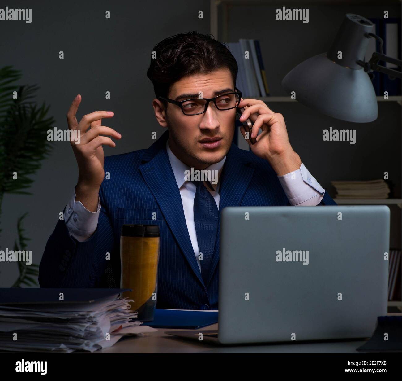 The employee working late to finish important deliverable task Stock ...