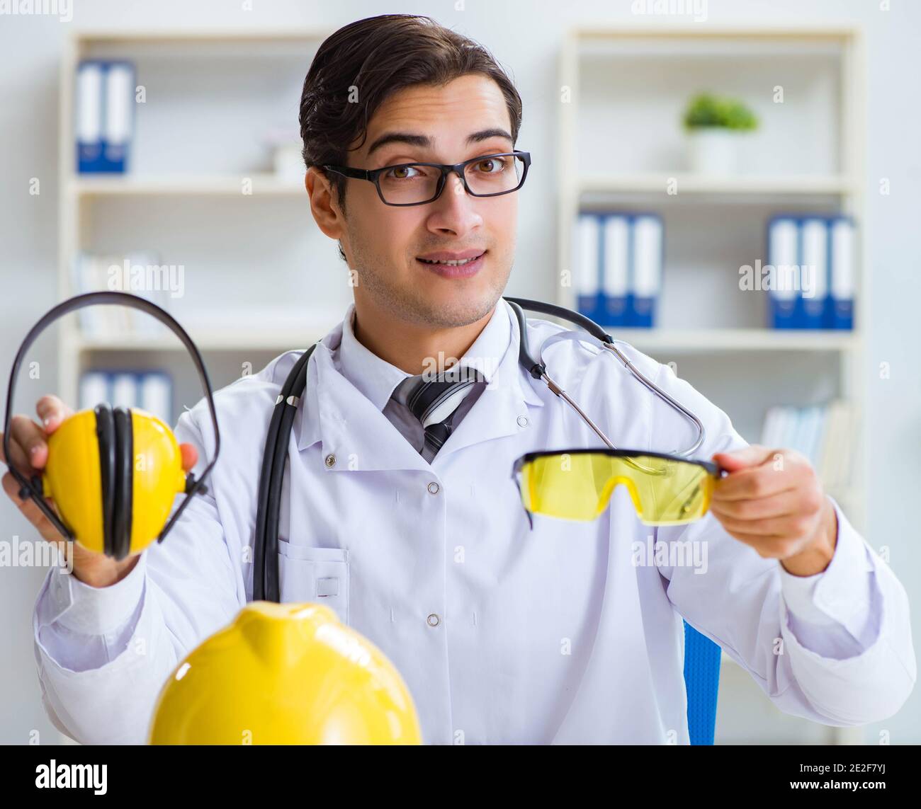 The safety doctor advising about wearing protective goggles Stock Photo ...