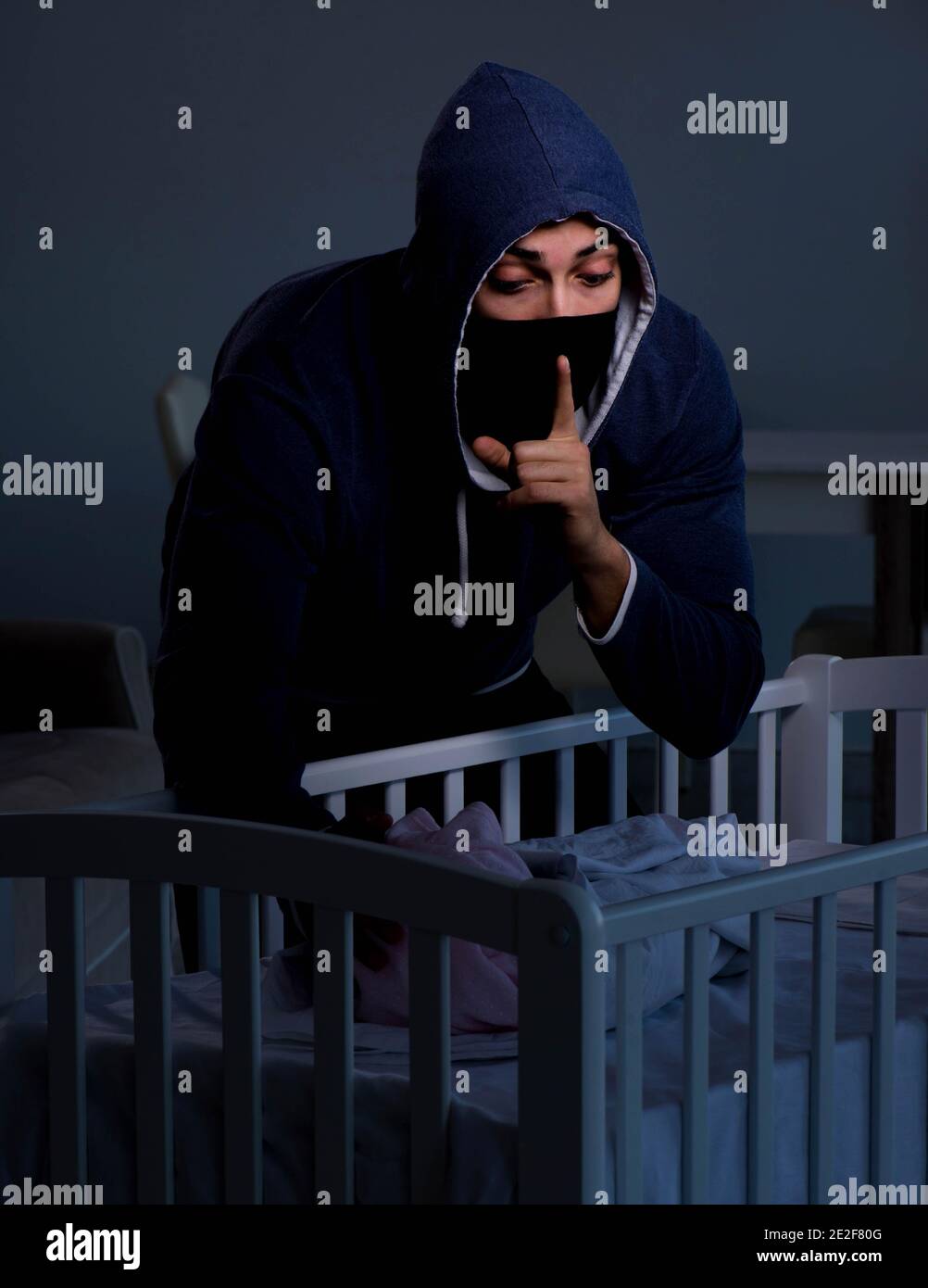 The criminal stealing baby in human child traficking concept Stock ...