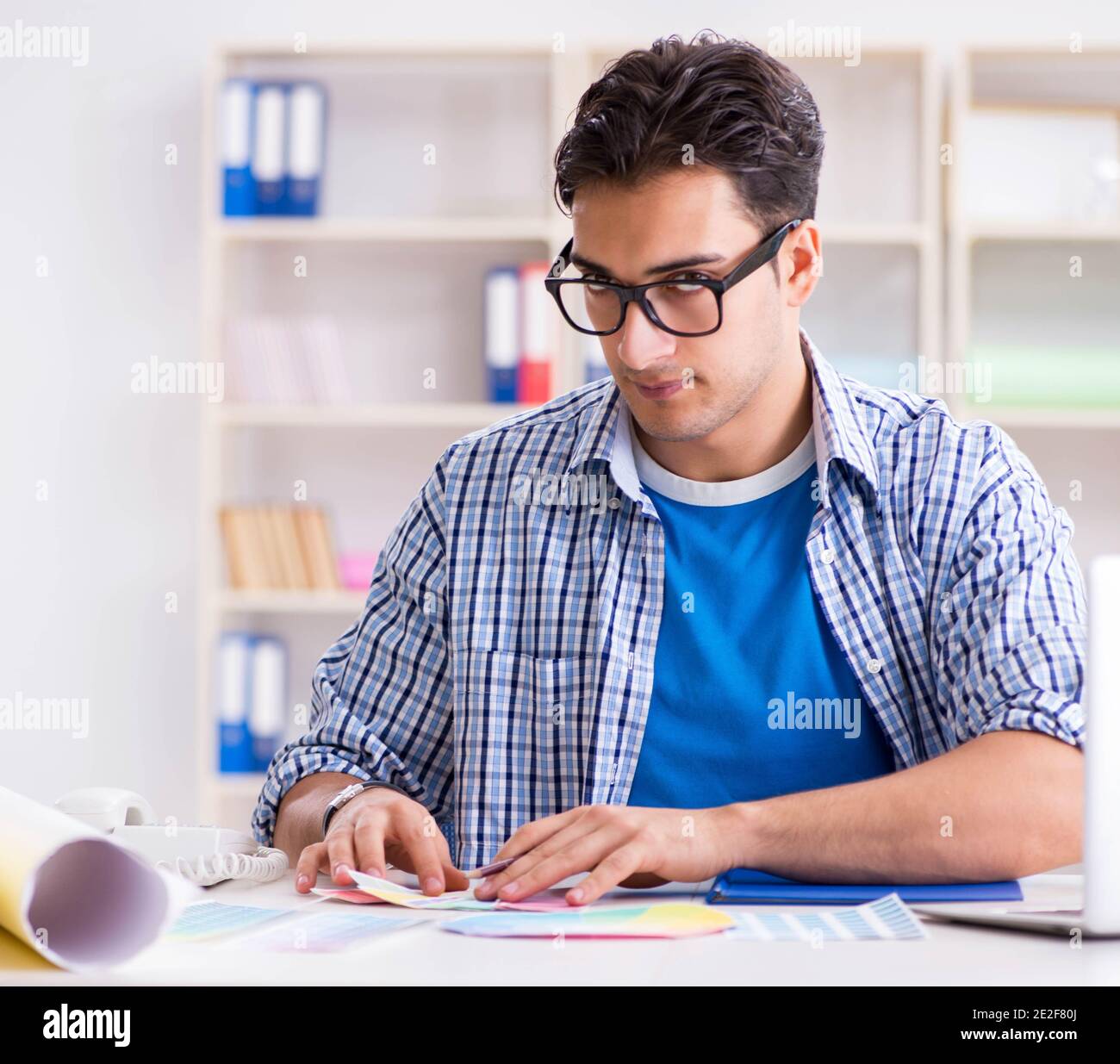 The young designer working on new project and choosing colours Stock ...