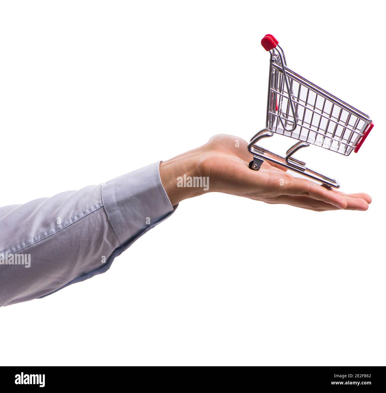 The hand holding shopping cart isolated on white Stock Photo - Alamy