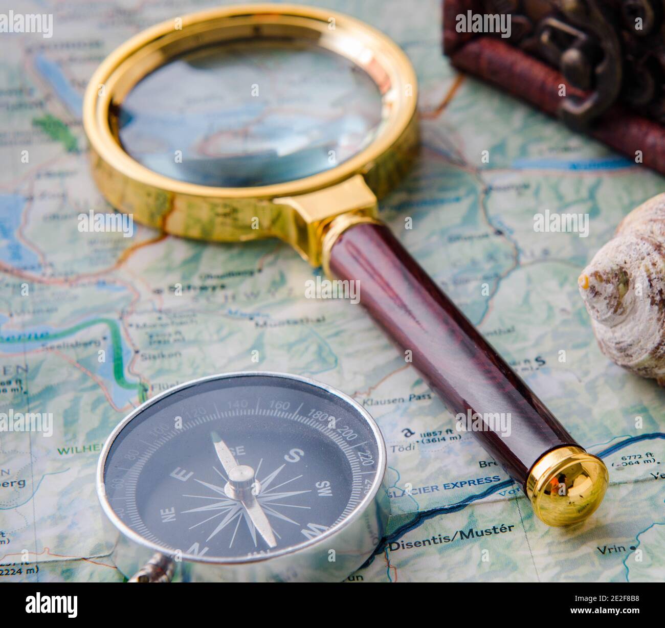 The travel concept with compass and map Stock Photo - Alamy