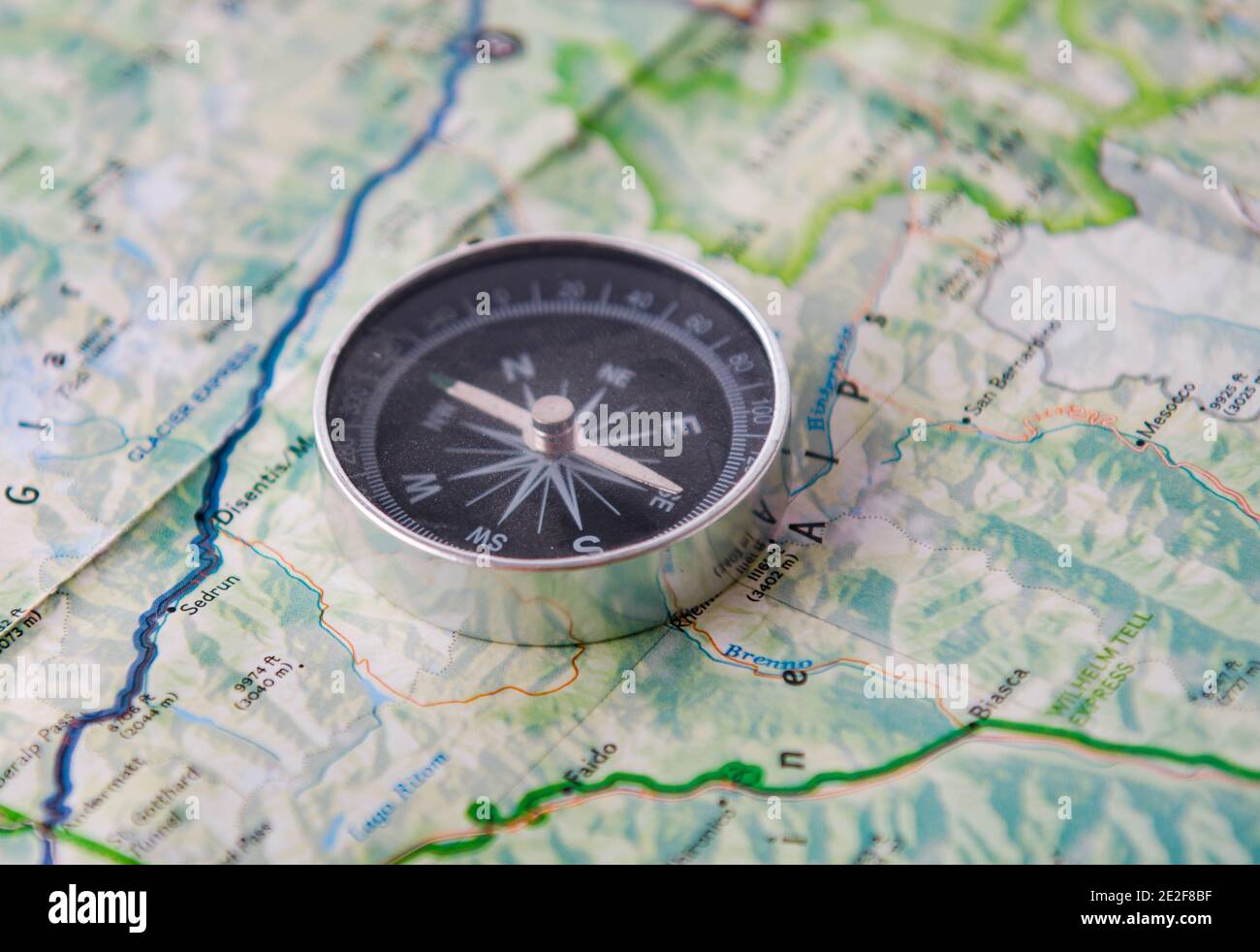 The travel concept with compass and map Stock Photo - Alamy