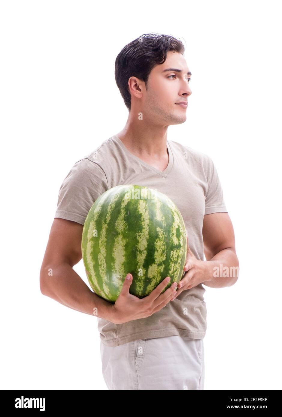 The young man with watermelon isolated on white Stock Photo - Alamy