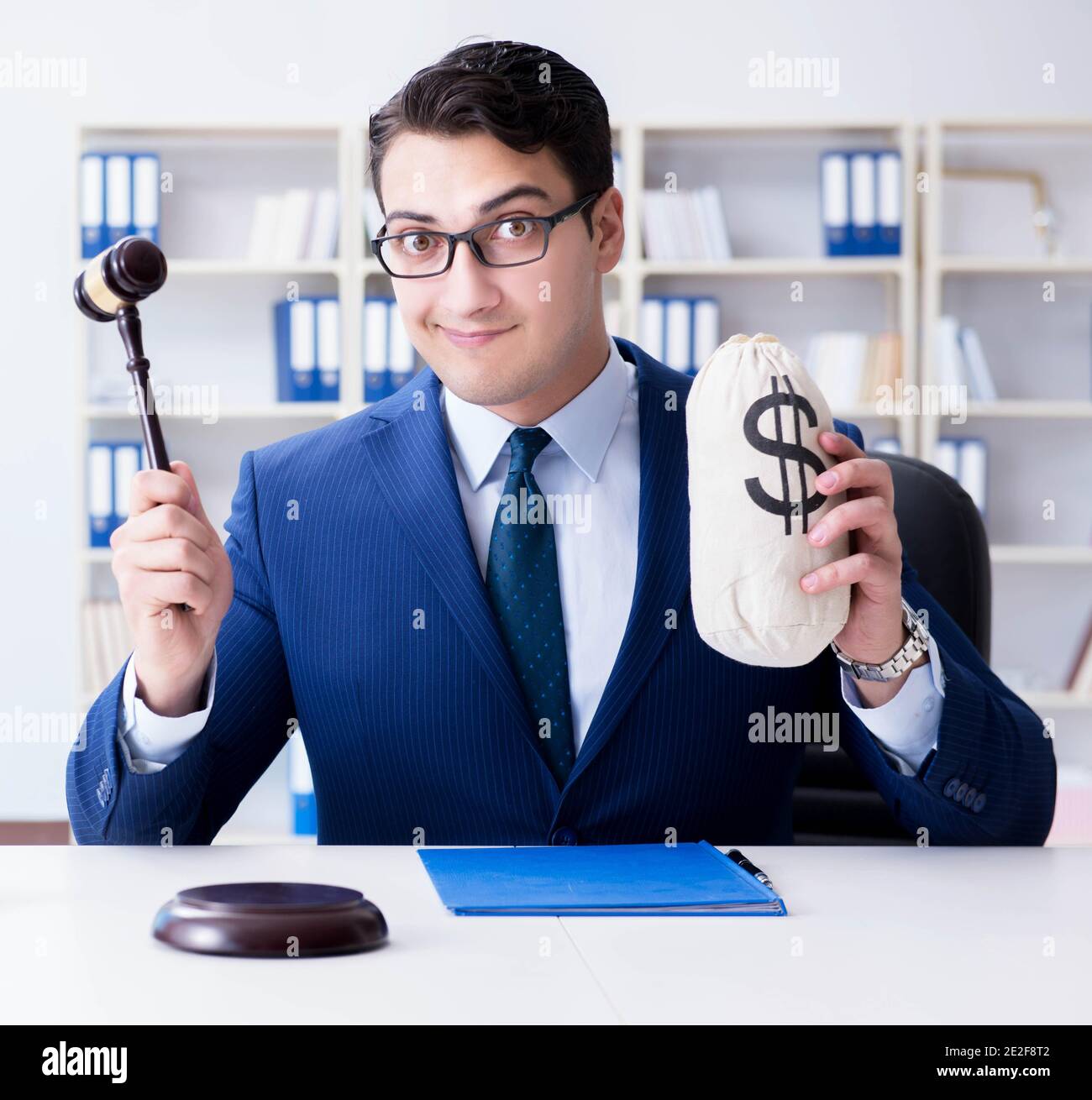 The judge in bribe concept with money Stock Photo - Alamy