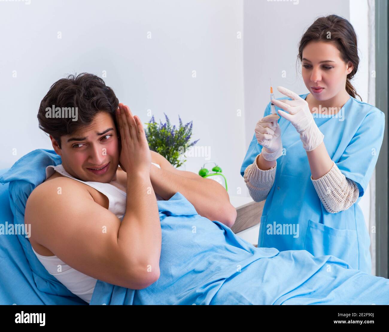 The doctor doing medical injection in hospital room Stock Photo - Alamy
