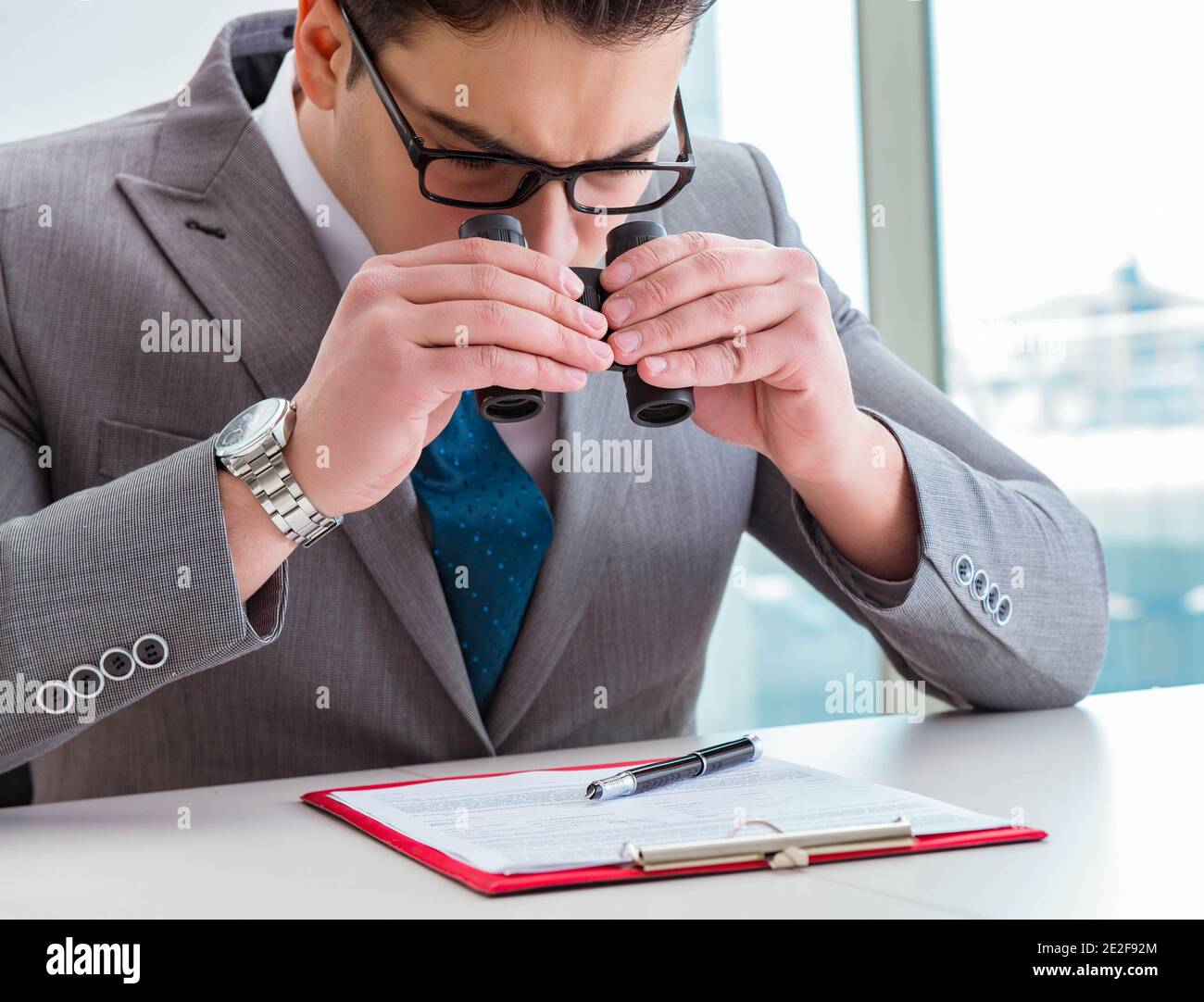 The man looking for errors and mistakes in report Stock Photo - Alamy