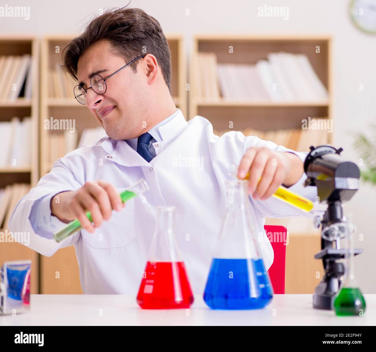 The mad crazy scientist doctor doing experiments in a laboratory Stock ...