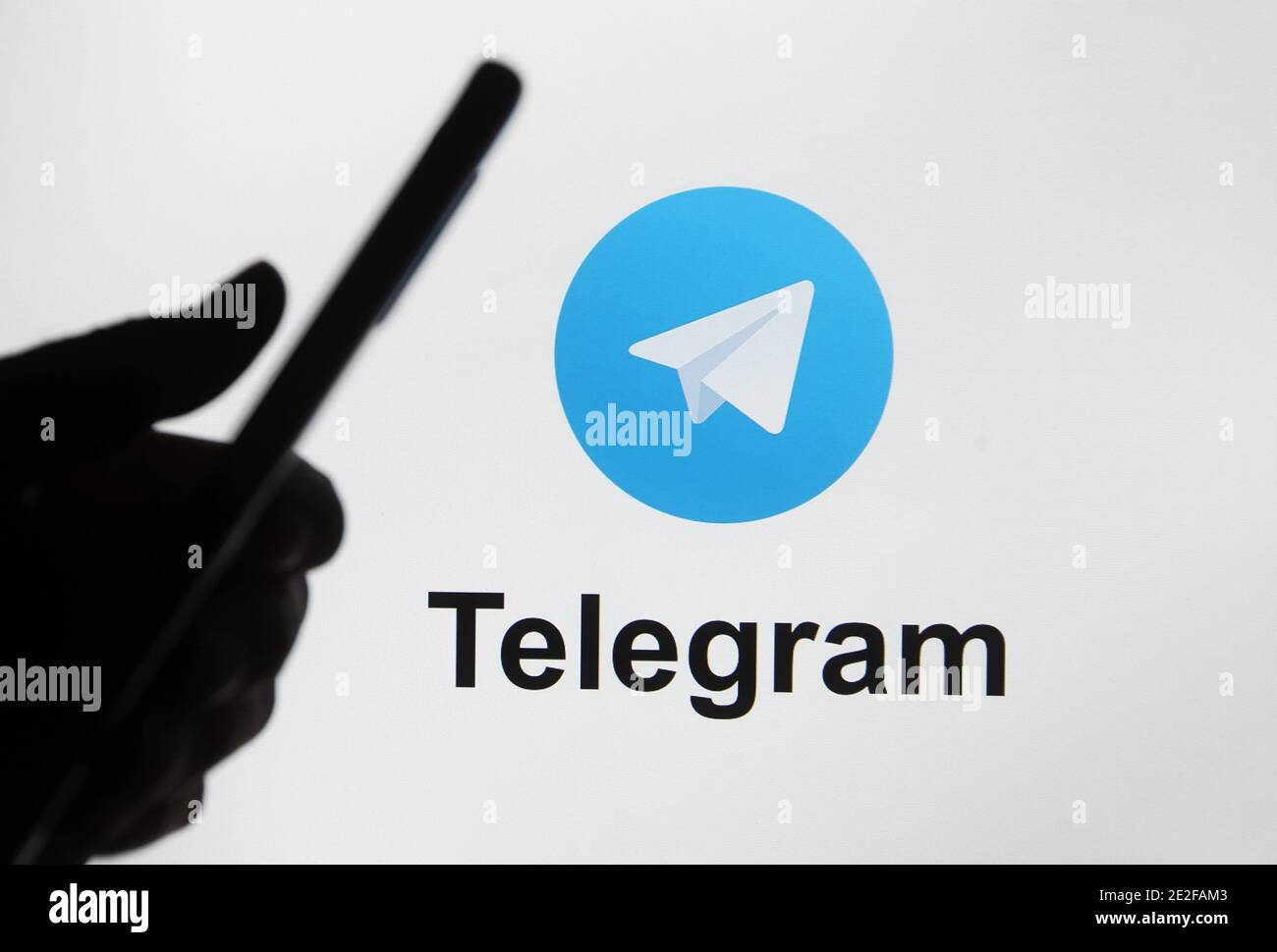 In this photo illustration, Telegram logo is seen on a screen behind ...