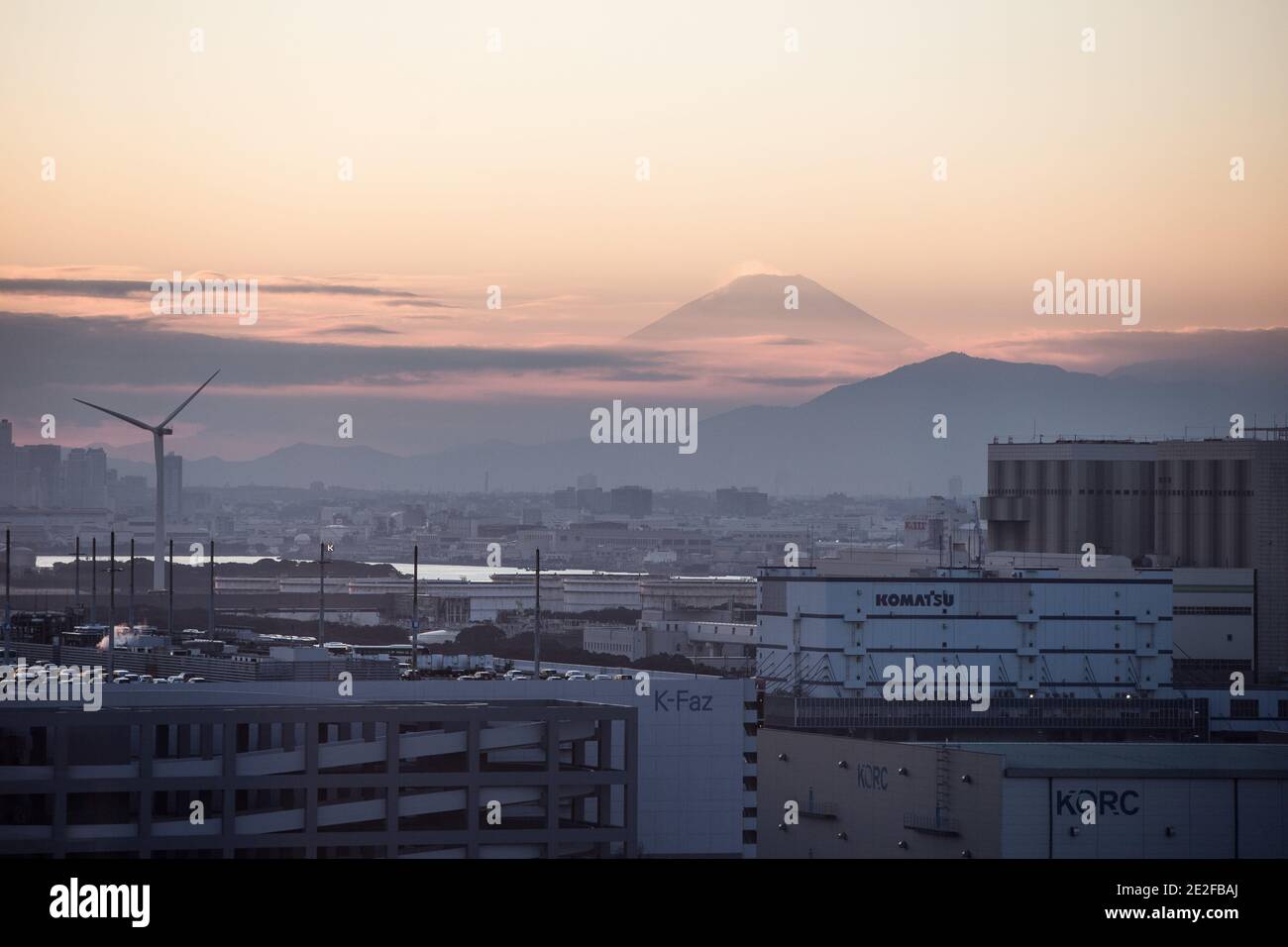 Mount Fuji seen during sundown from Kawasaki industrial zone.The ...