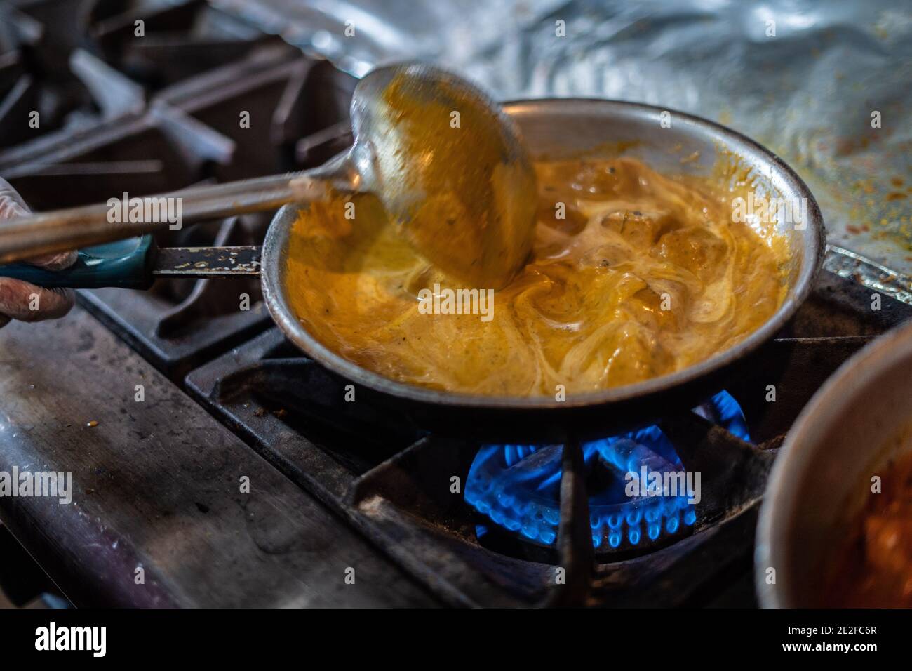 Cooking indian style cuisine food Stock Photo - Alamy