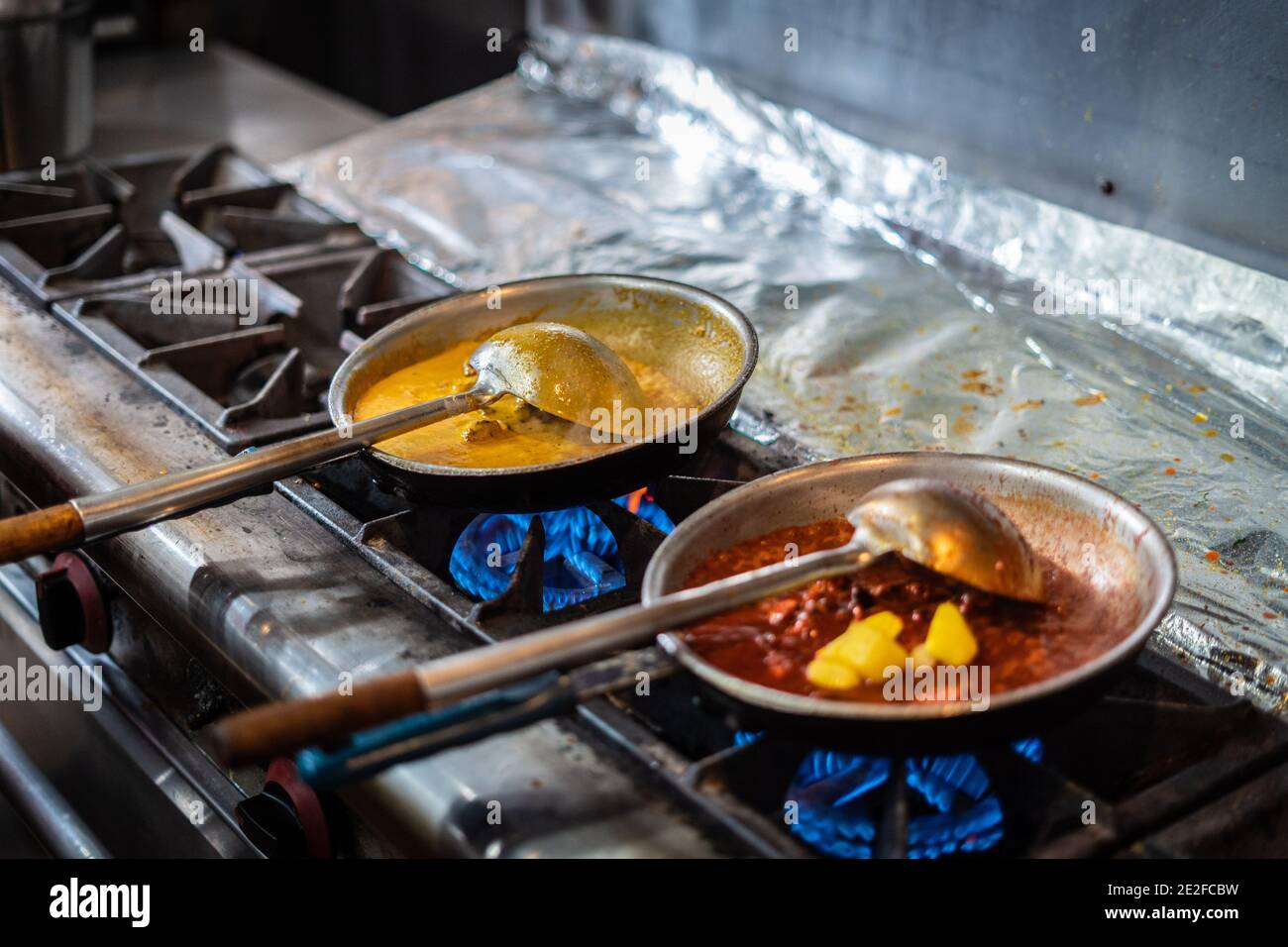 Cooking indian style cuisine food Stock Photo - Alamy