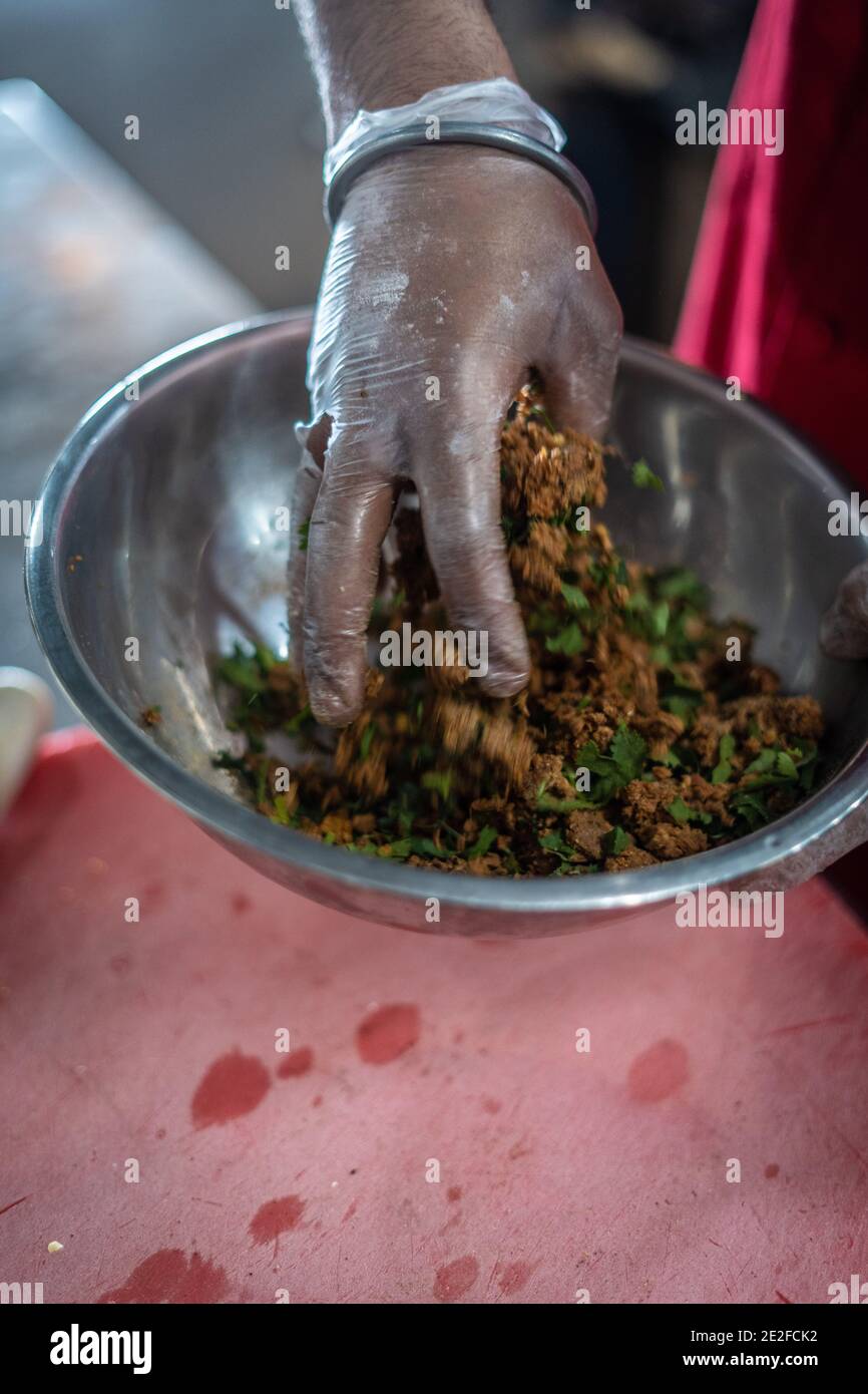 Chef preparing cooking and serving indian cuisine style dish Stock ...