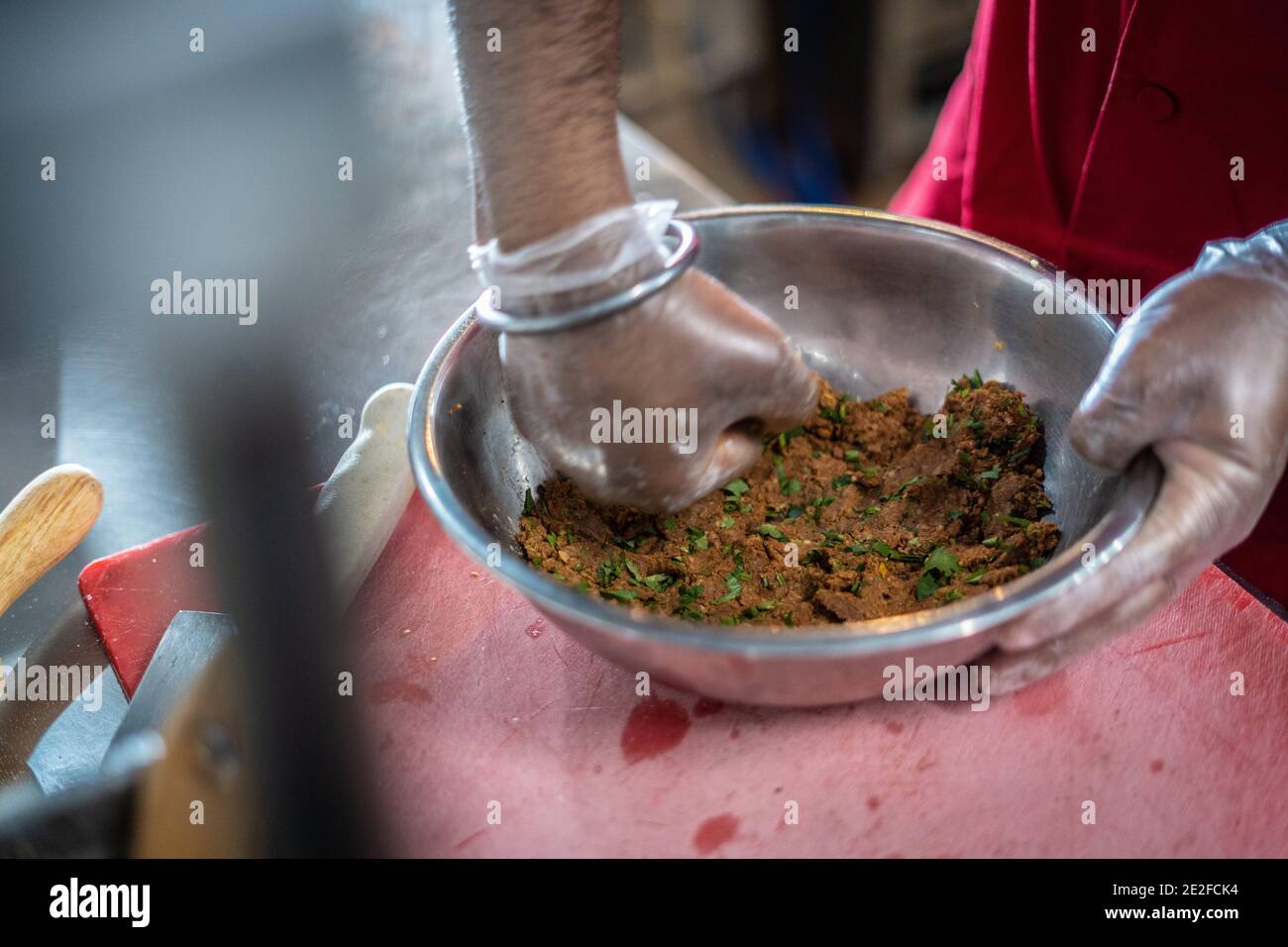 Chef preparing cooking and serving indian cuisine style dish Stock ...