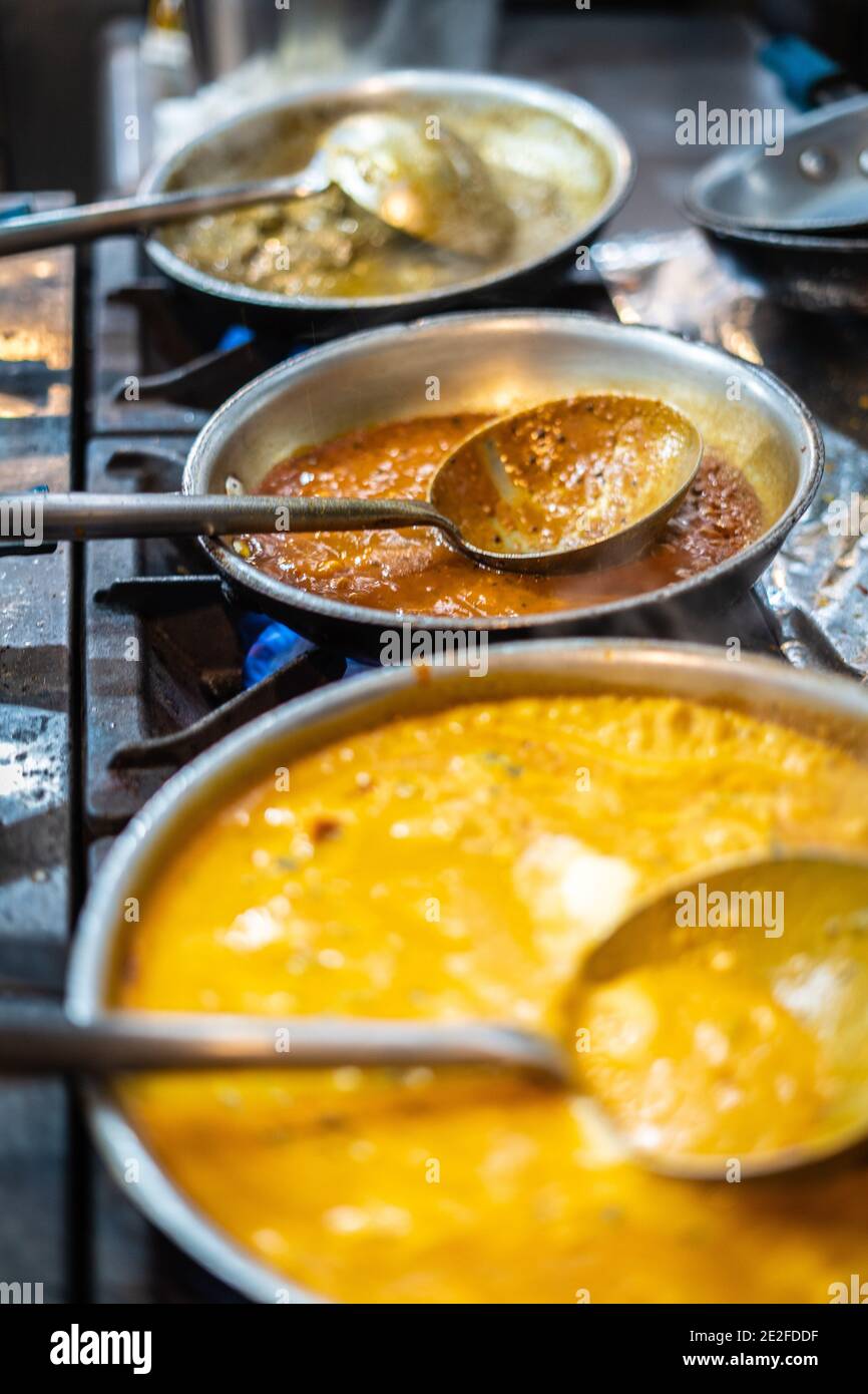 Cooking indian style cuisine curry dish Stock Photo - Alamy
