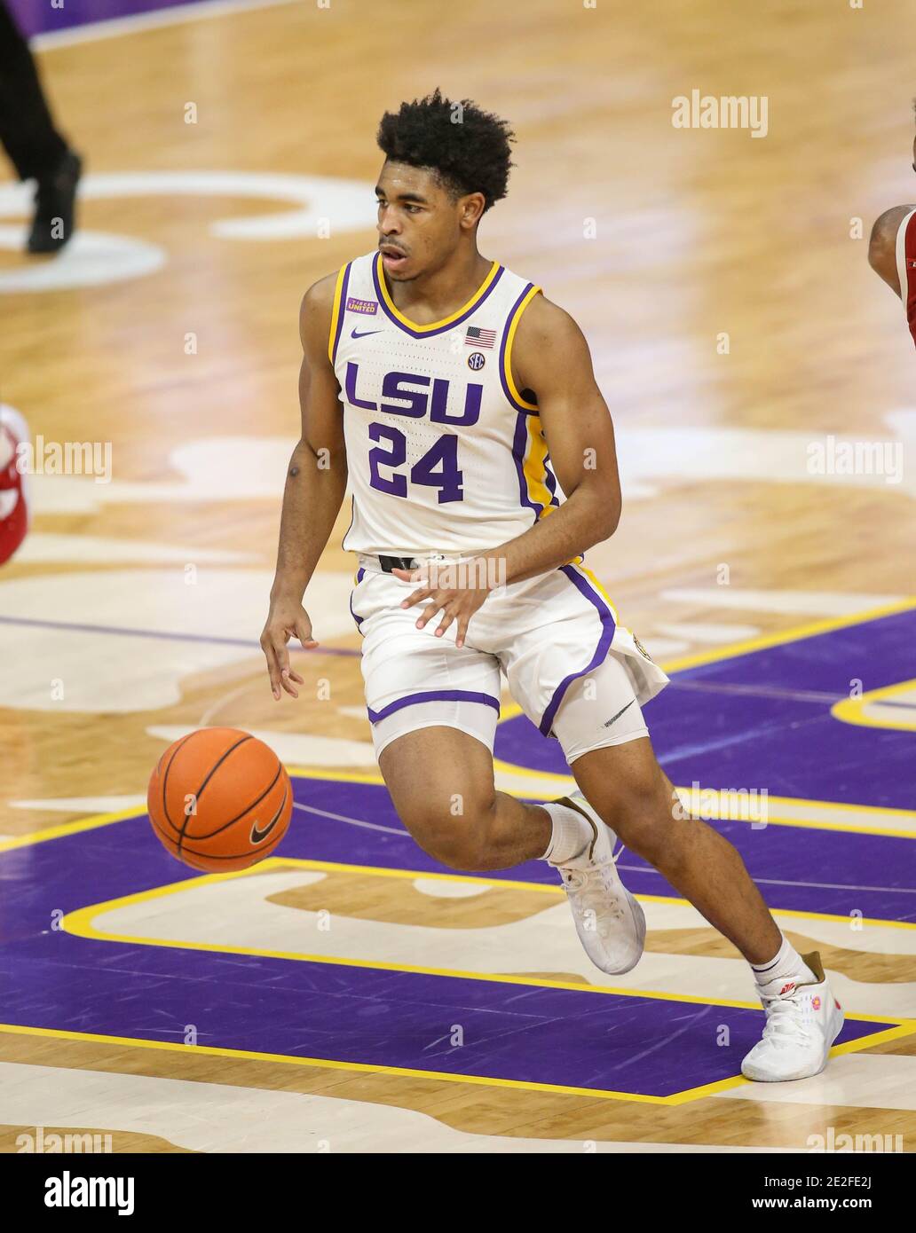 Baton Rouge, LA, USA. 13th Jan, 2021. LSU's Cameron Thomas (24) drives ...