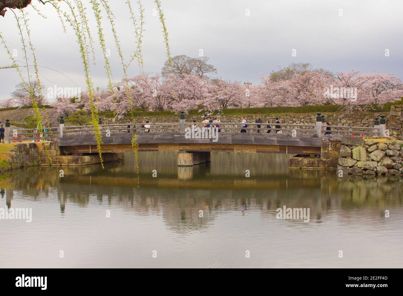 Beautiful view of people walking on the bridge at the Himeji castle in ...