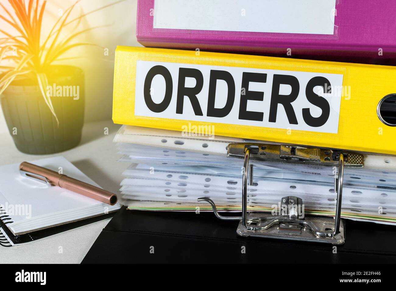 Office folder with inscription (text: ORDERS) and other office supplies ...