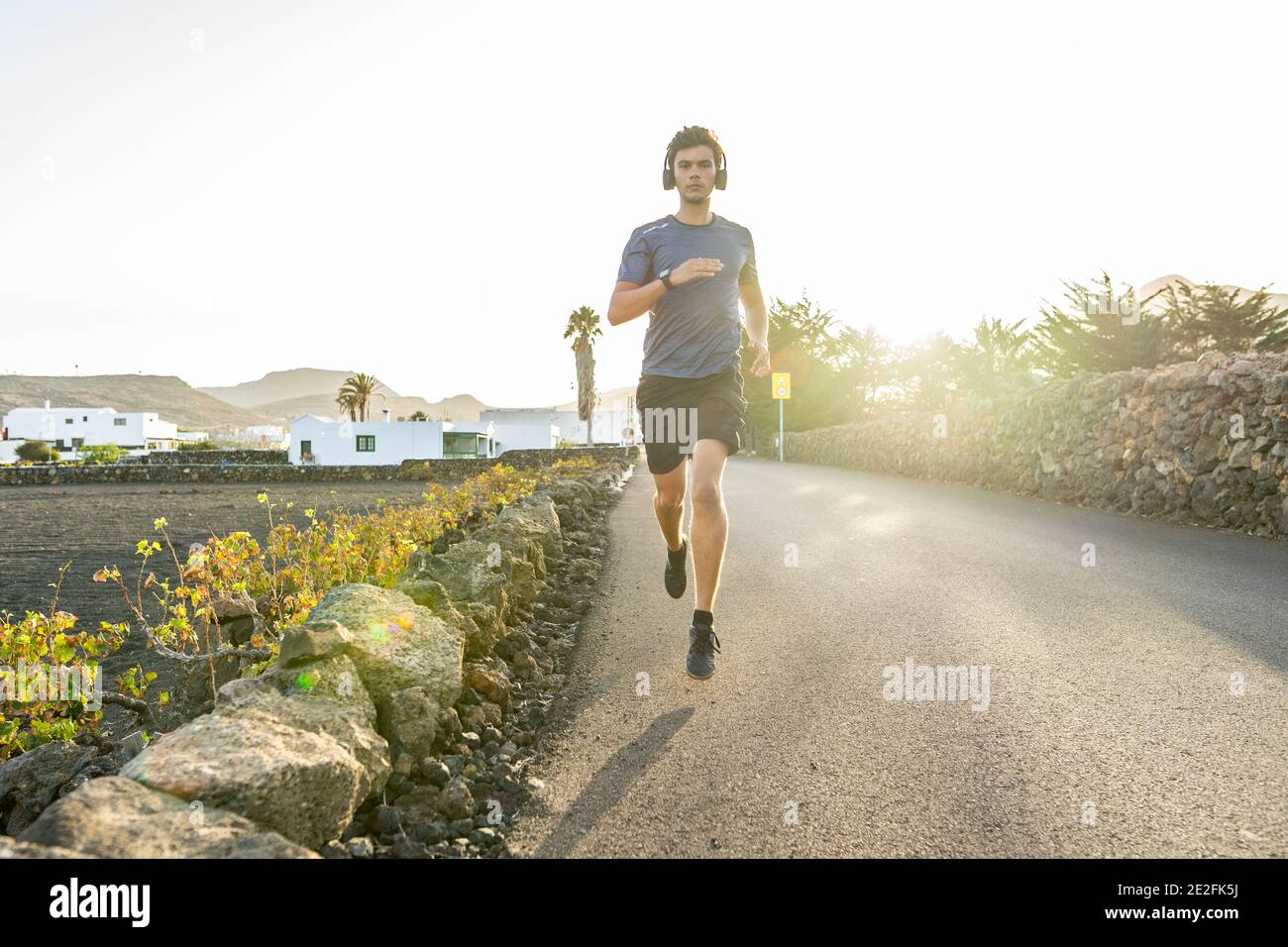 Athletic man running during the outdoors morning workout Stock Photo ...