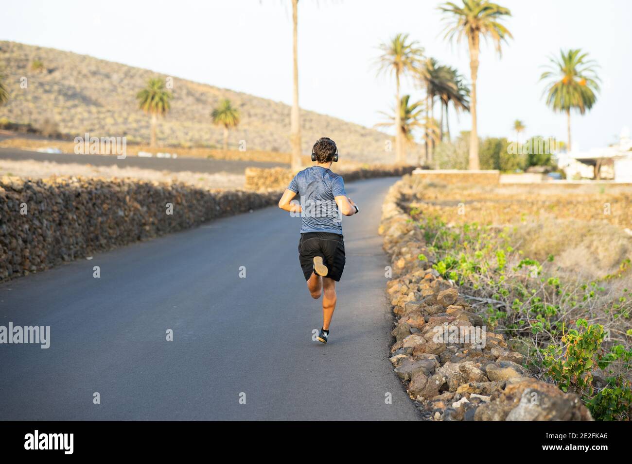 Athletic man running during the outdoors morning workout Stock Photo ...
