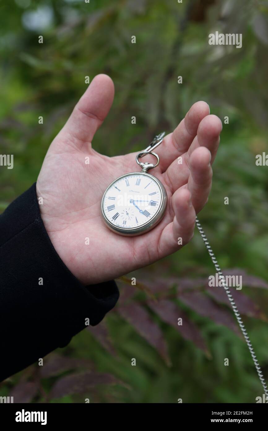 Mans hand holds silver hi-res stock photography and images - Alamy