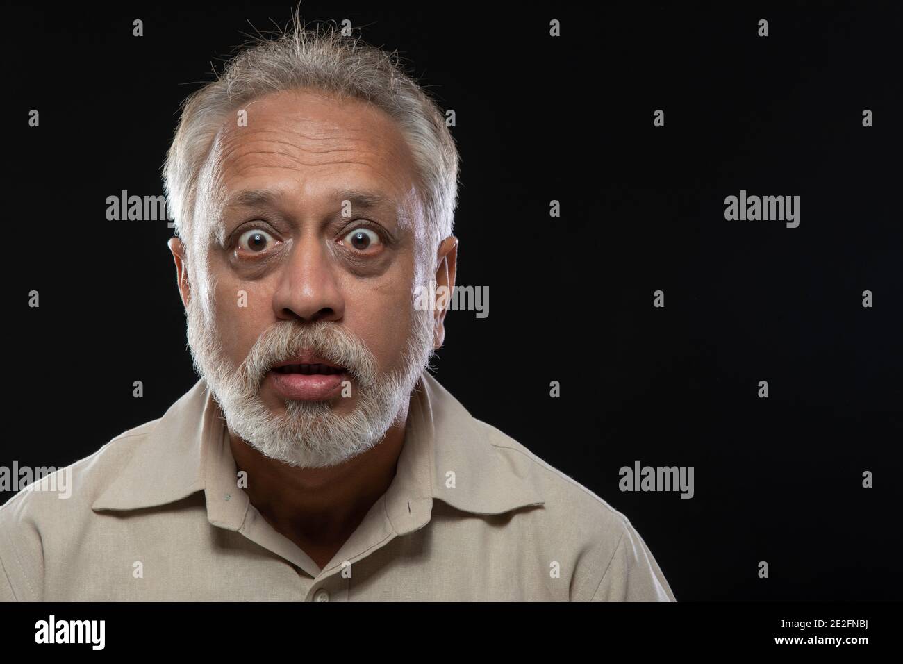AN OLD MAN LOOKING AT CAMERA IN SHOCK Stock Photo - Alamy