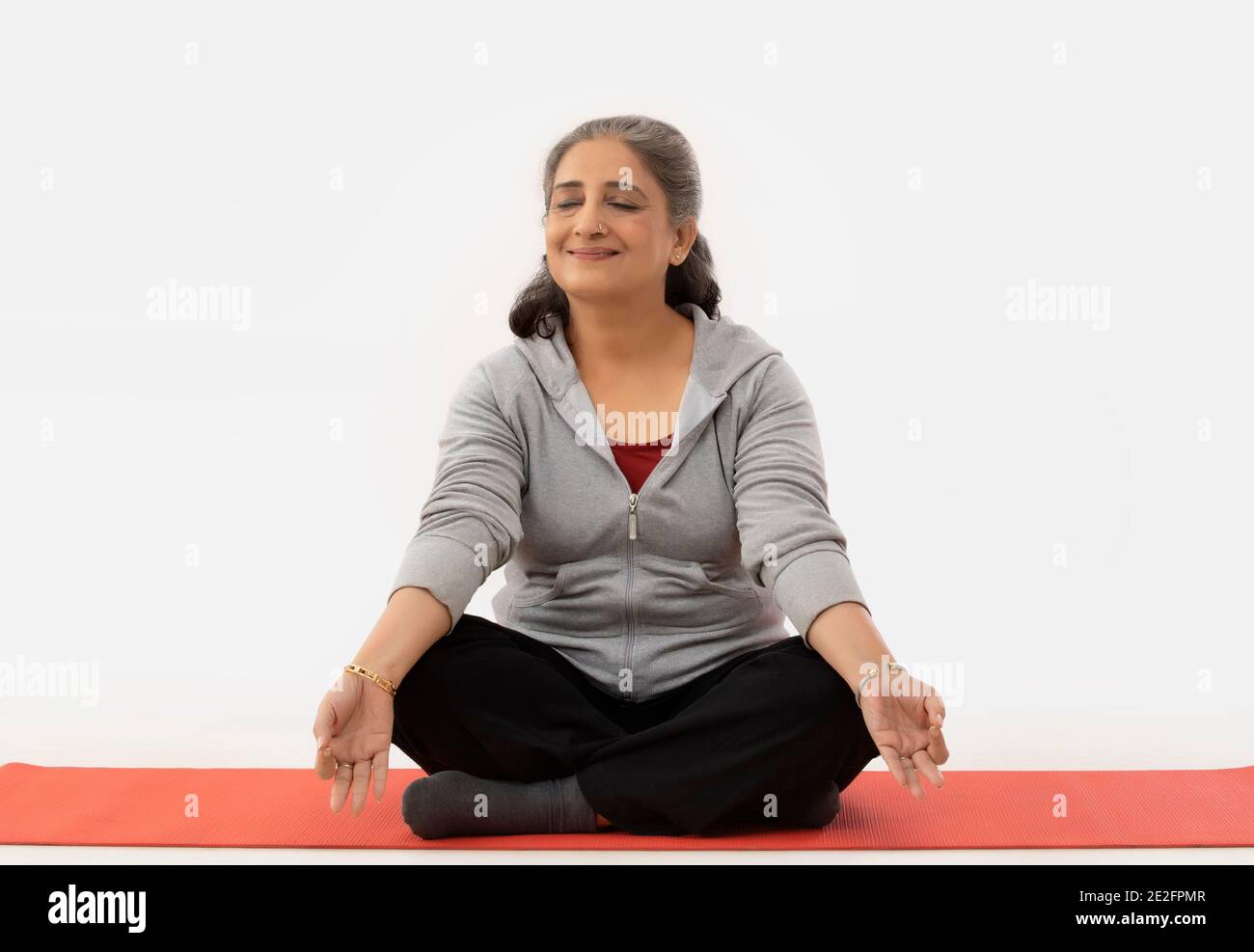 Indian person meditating hi-res stock photography and images - Alamy