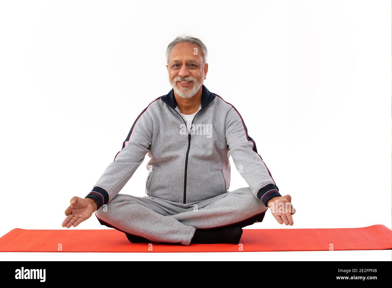 AN ADULT MAN SMILING HAPPILY WHILE DOING MEDITATION Stock Photo - Alamy