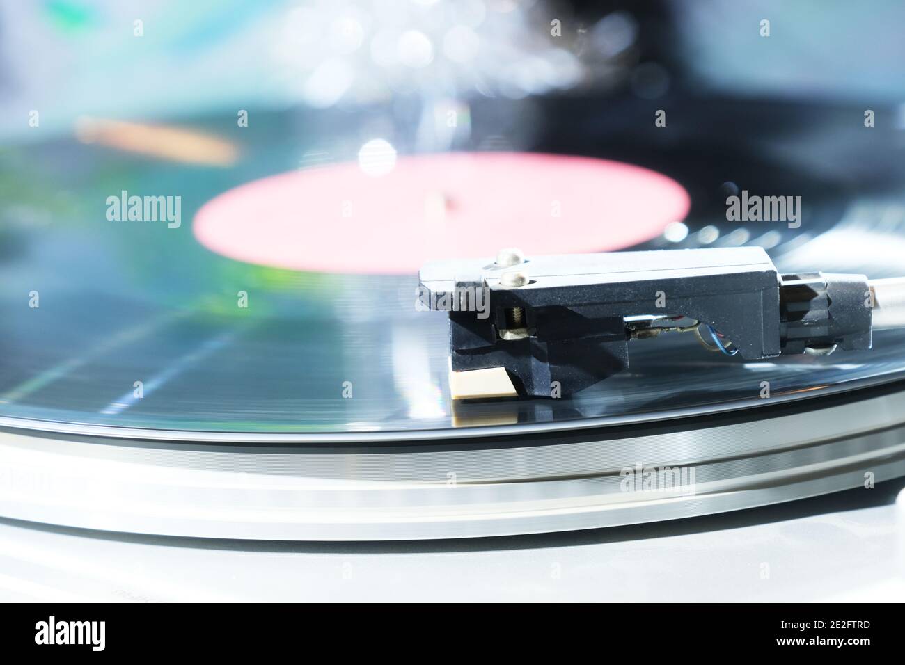 Vinyl record player, bright lights disco-bokeh Stock Photo - Alamy