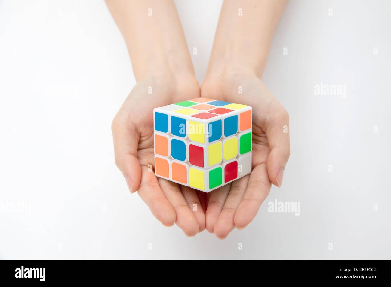 Rubiks cube and hands hi-res stock photography and images - Alamy