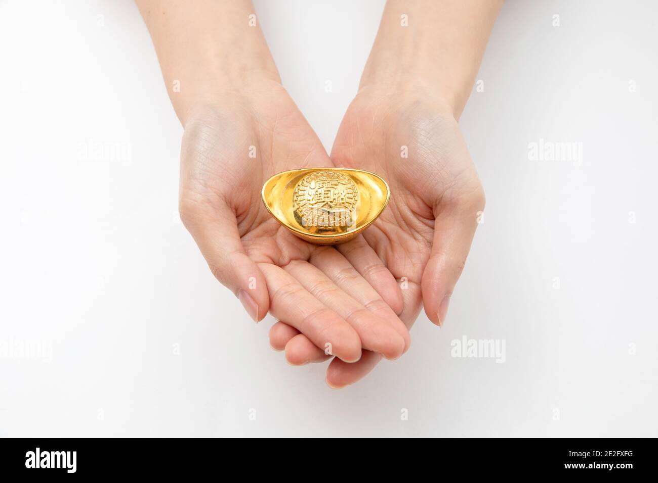 Gold ingot hands hi-res stock photography and images - Alamy