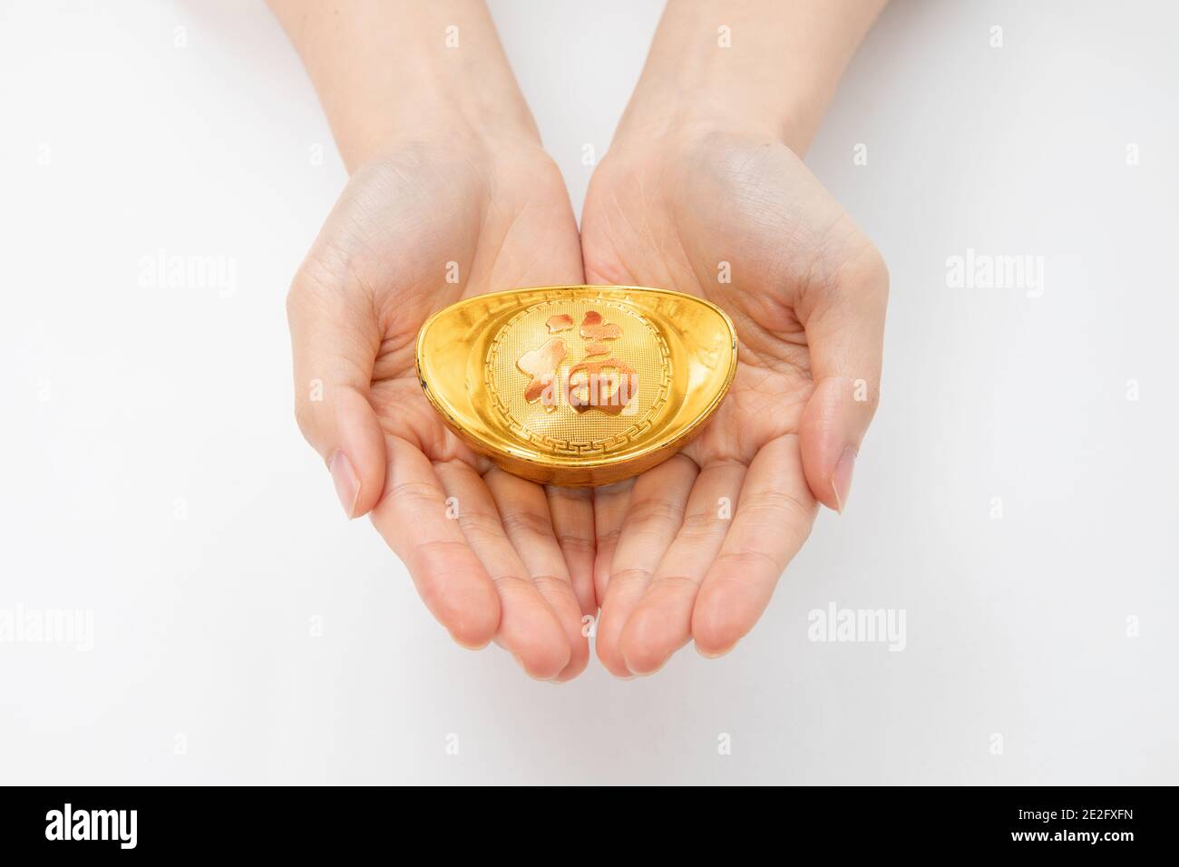 Gold ingot hands hi-res stock photography and images - Alamy