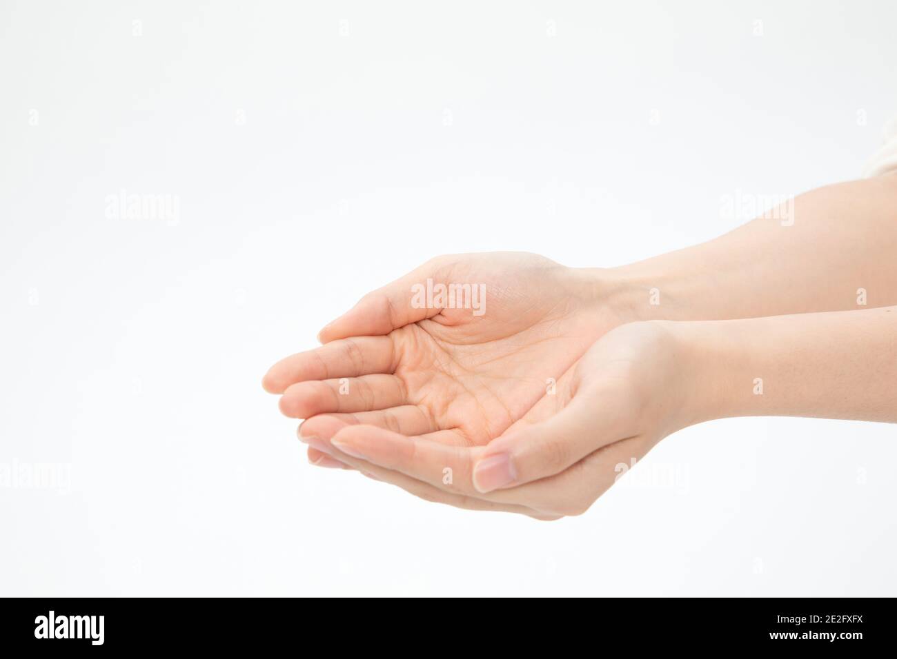 Closeup shot of hands in a begging gesture isolated on a white ...