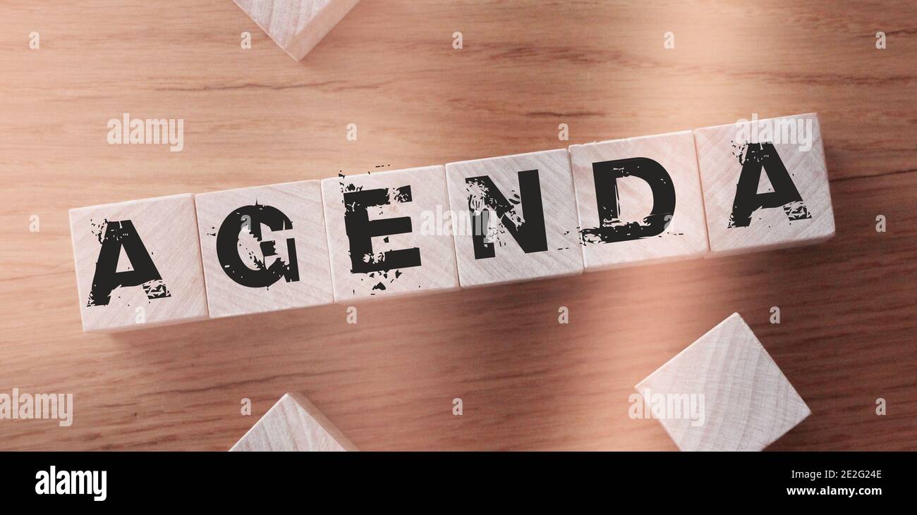 Agenda - words from wooden blocks with letters, a list of matters ...