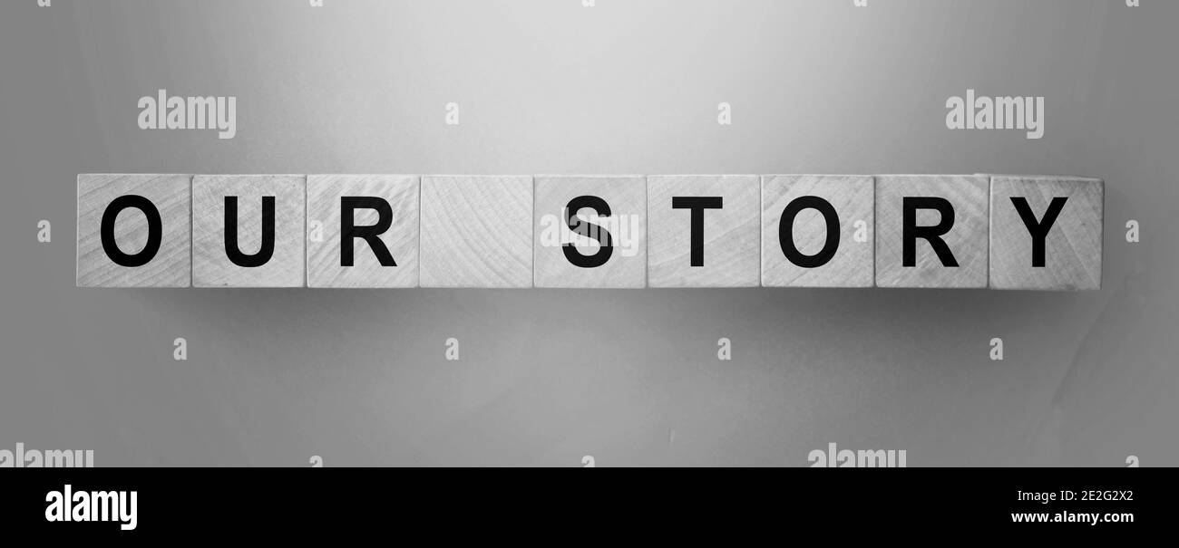 OUR STORY words on wooden cubic building block . Business with history ...