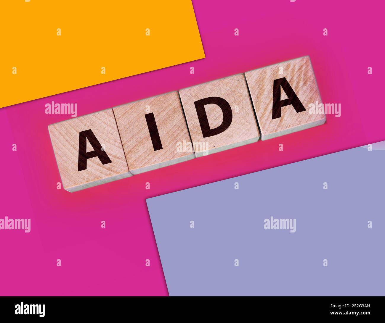Four wooden cubes with letters AIDA meaning Attention Awareness ...