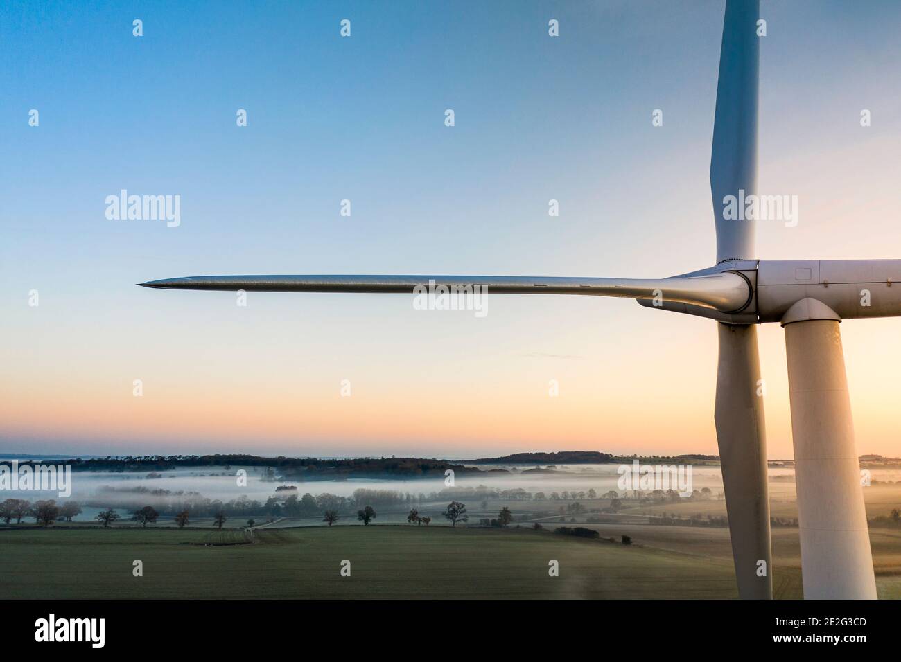 Aerial close up view of the blades of a commercial wind turbine at ...