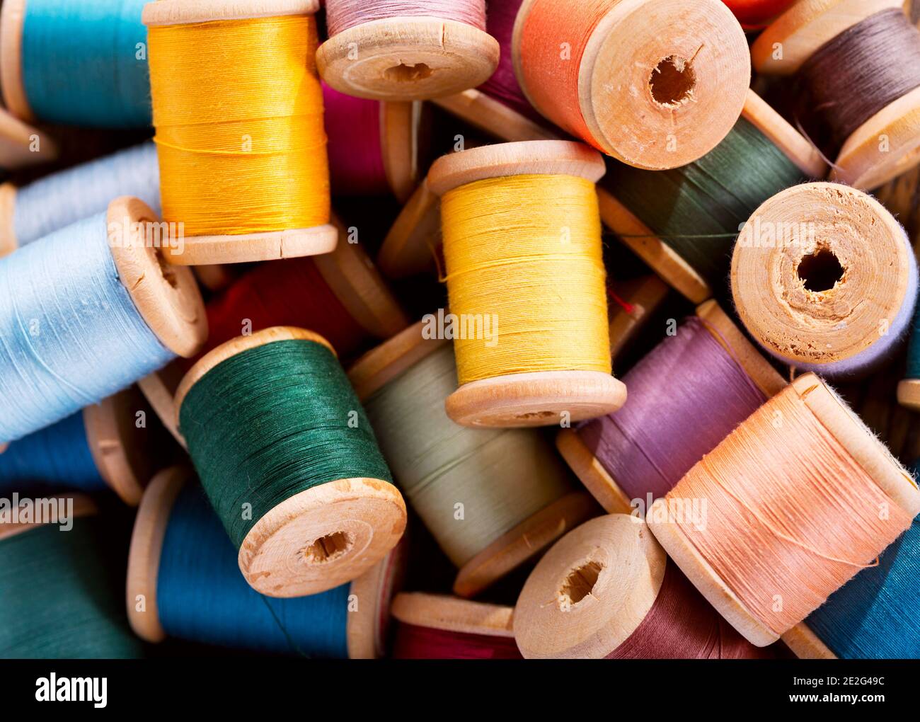 colorful thread spools as background Stock Photo - Alamy