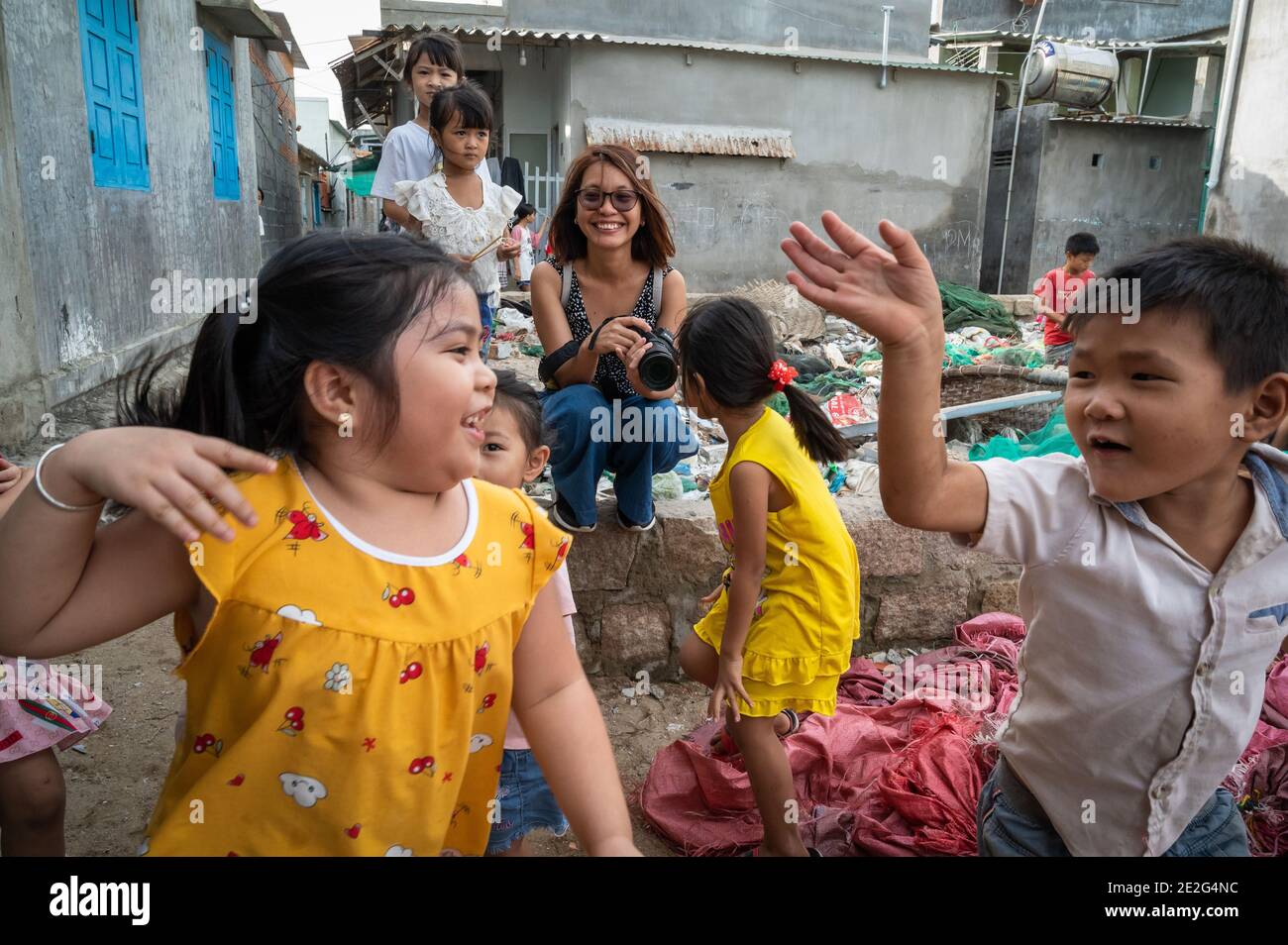 Vietnamese photographer with children having fun, Phan Rang, Vietnam ...