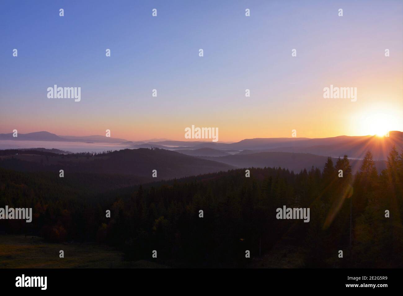 Aerial shot of a pink sunrise over the mountains Stock Photo - Alamy