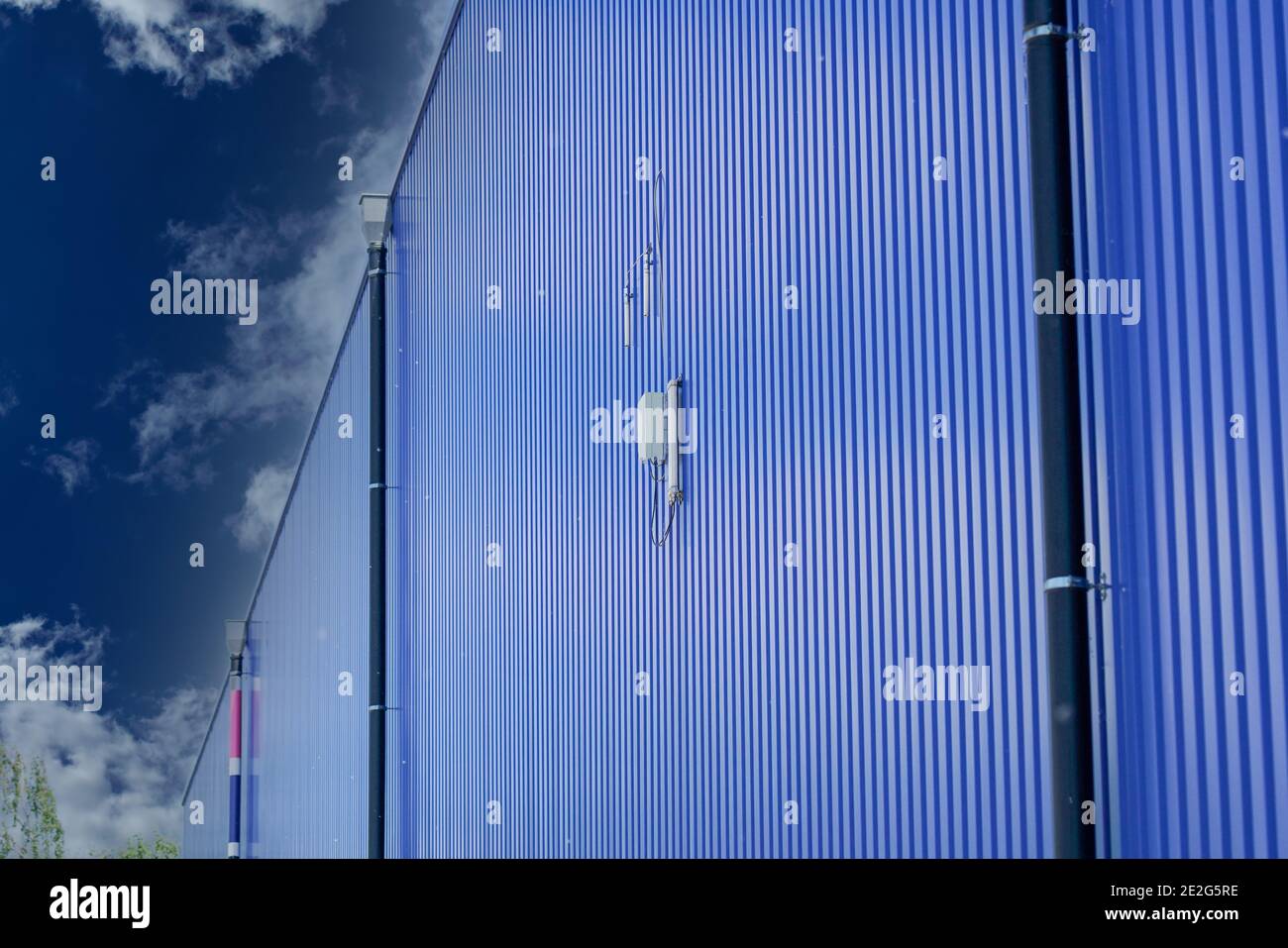 Shot of a sheet metal facade cladding with gutters on a building of an ...